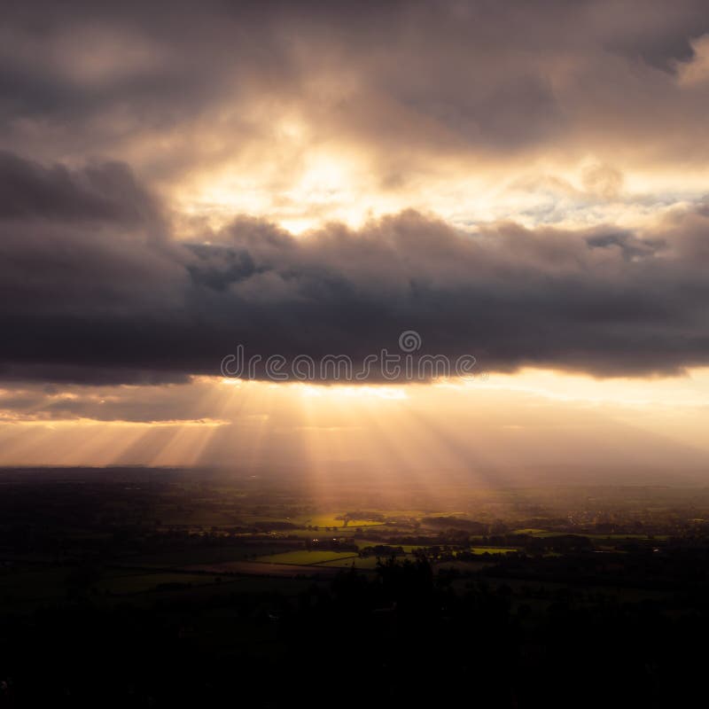 Dramatic Sun Rays Beaming Down on Mountains Stock Image - Image of ...