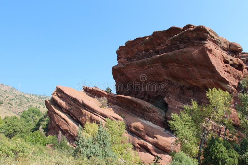 Dramatic Red Sandstone Formation Jutting Out of the Ground, Surrounded ...