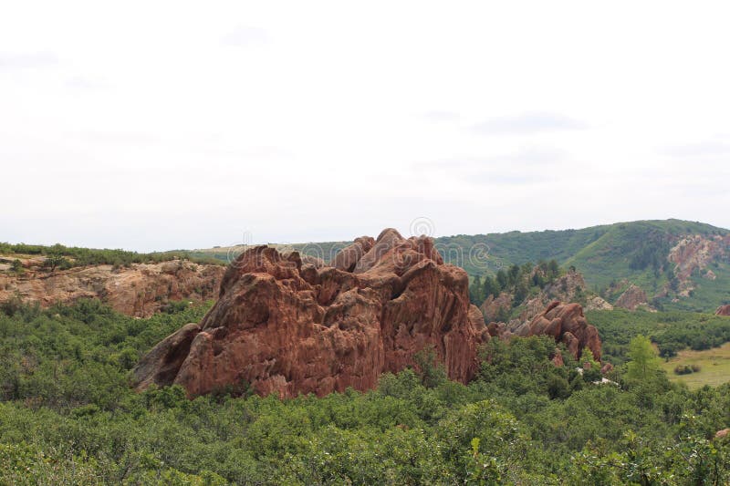Dramatic Red Sandstone Formations Jutting Out of the Ground, Surrounded ...