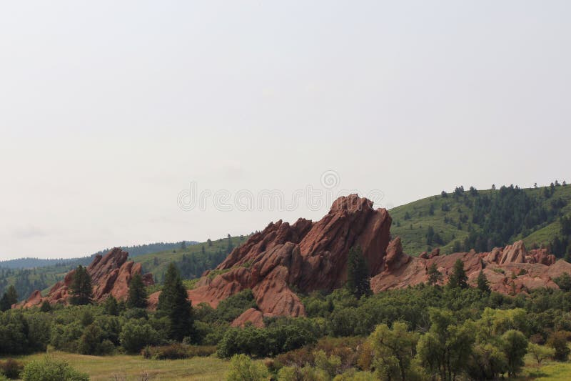 Dramatic Red Sandstone Formations Jutting Out of the Ground, Surrounded ...