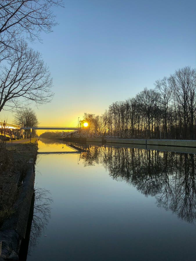 Dramatic river sunrise stock image. Image of grass, scene - 145910657