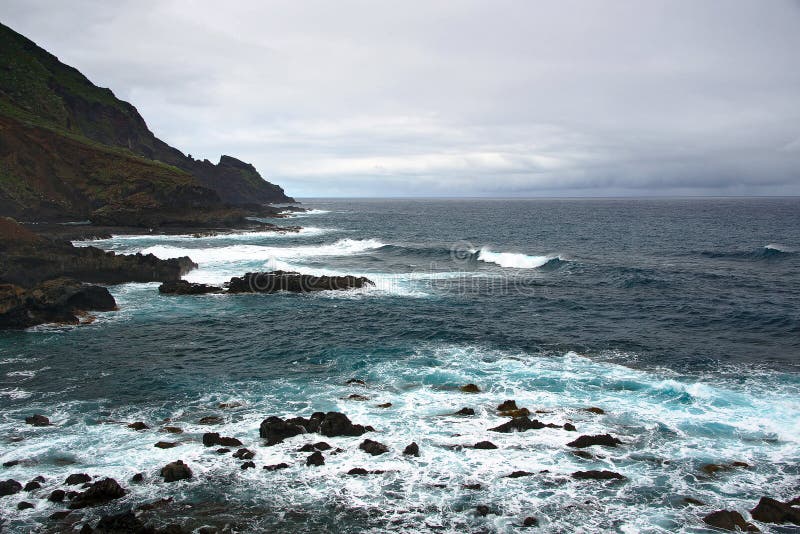Dramatic Rocky Beach Landscape Stock Photo - Image of surf, cliffs ...