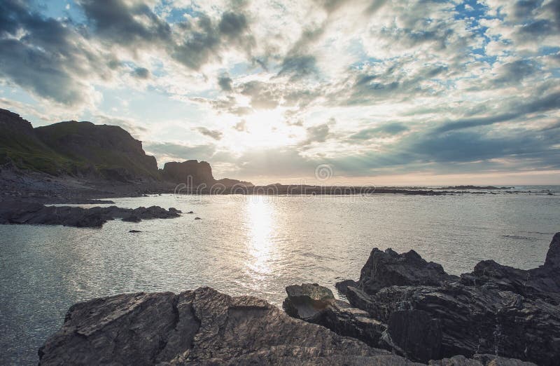 Dramatic Scene with Big Rocks, Sea, Sunbeam and Sundown Stock Image ...