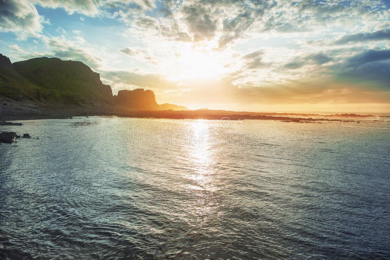Dramatic Scene with Big Rocks, Sea, Sunbeam and Sundown Stock Image ...