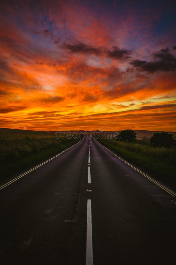 Dramatic Scene of Bright Orange Sunset Over the Free Endless Highway ...