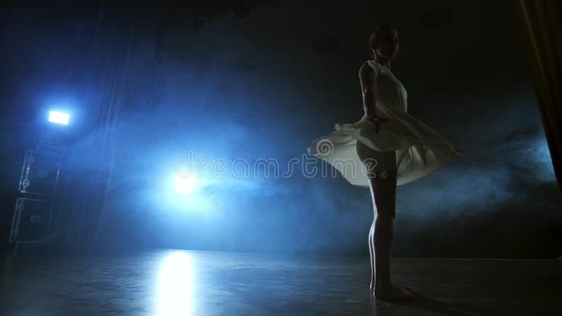 A Dramatic Scene of Modern Ballet, a Lone Ballerina in a White Dress ...