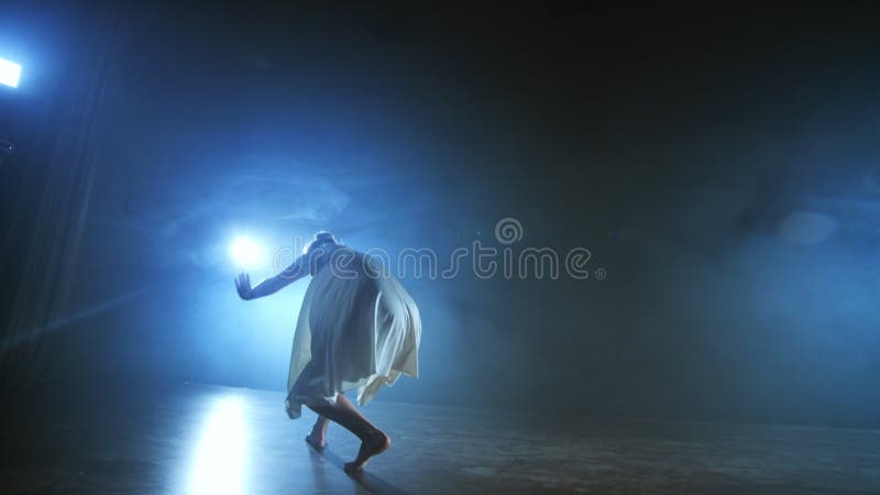 A Dramatic Scene of Modern Ballet, a Lone Ballerina in a White Dress ...