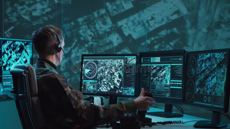 Military Soldier Operating Advanced Technology in a Command Center ...