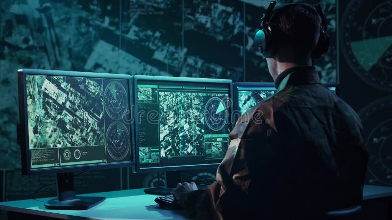 Military Soldier Operating Advanced Technology in a Command Center ...