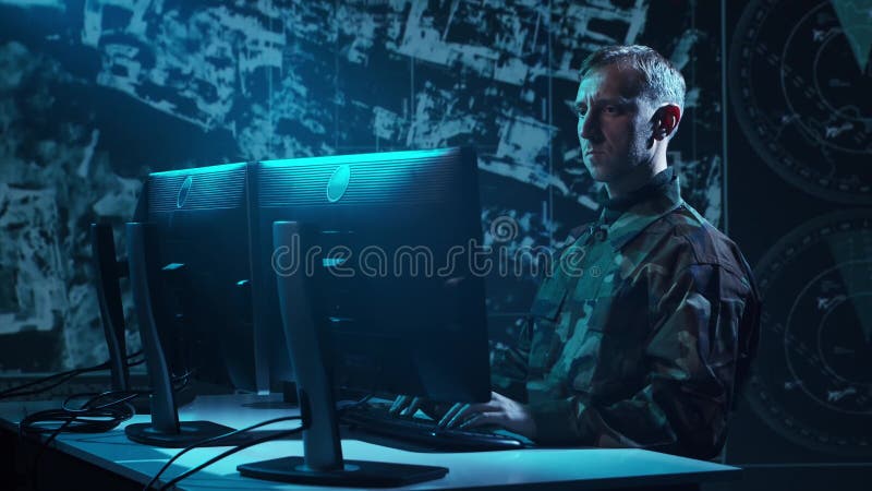 Military Soldier Operating Advanced Technology in a Command Center ...
