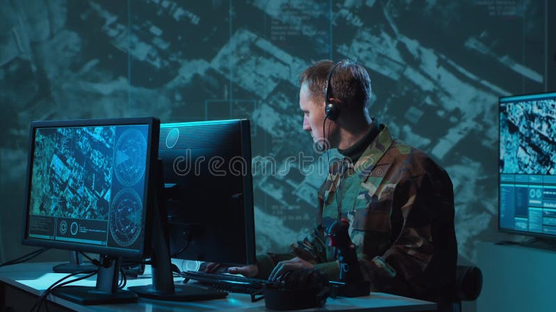 Military Soldier Operating Advanced Technology in a Command Center ...