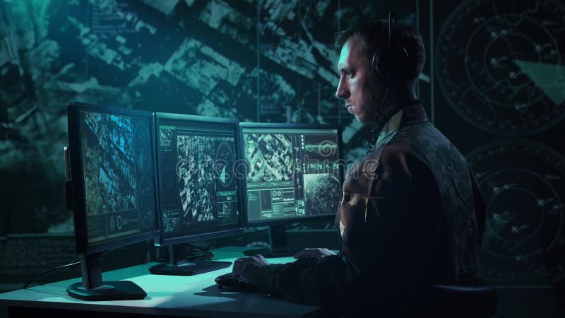 Military Soldier Operating Advanced Technology in a Command Center ...