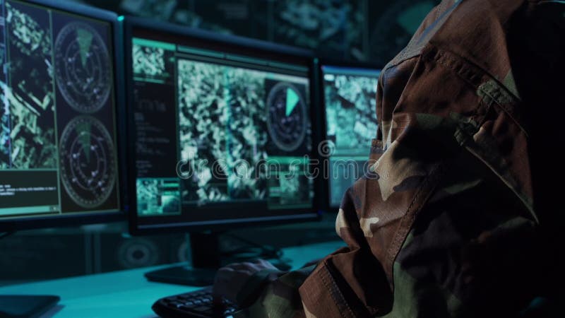 Military Soldier Operating Advanced Technology in a Command Center ...