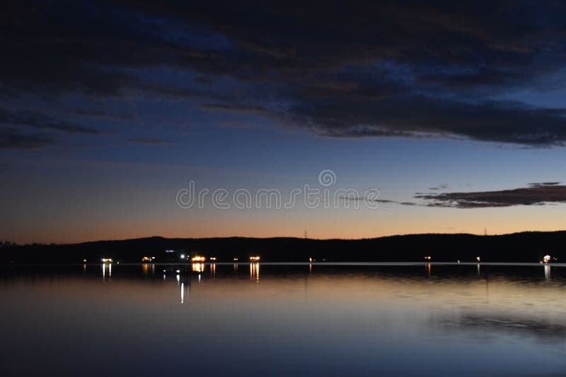 Dramatic Scenery of a Late Sunset in the Sky Over a Lake in the Evening ...