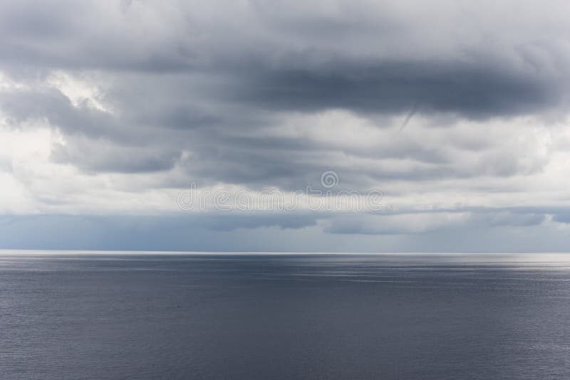 Dramatic Seascape Heavy Low Hanging Rain Clouds Over Ocean Stock Photos ...
