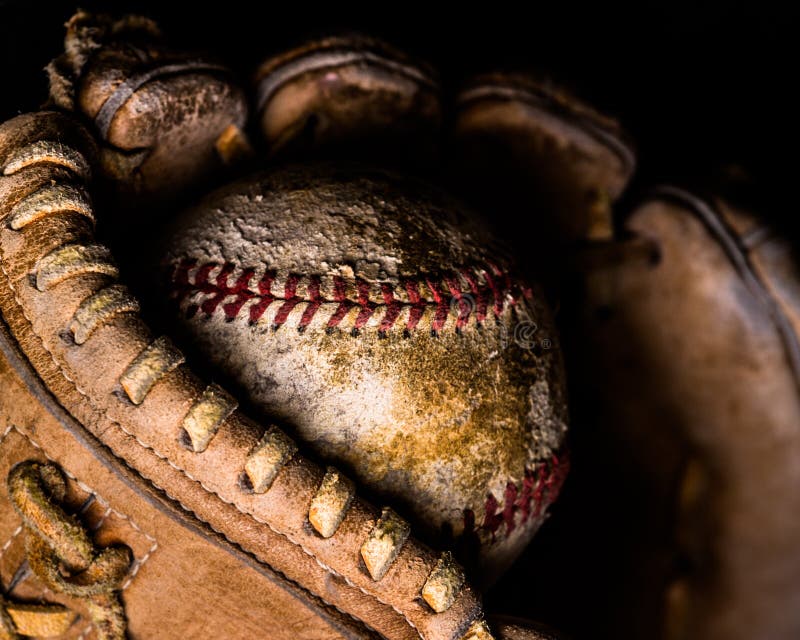 Dramatic Side Lighting on Old Baseball Caught in Worn Out Mitt Stock ...