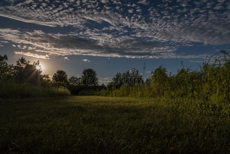 Dramatic Sky and Clouds Over Field Stock Image - Image of beams ...