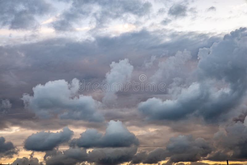 Dramatic Sky - Cumulus Clouds at Sunset Background. Dense Layered ...
