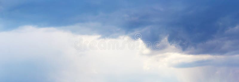 Dramatic Sky with Dark Clouds Above and Clouds Below Stock Photo ...