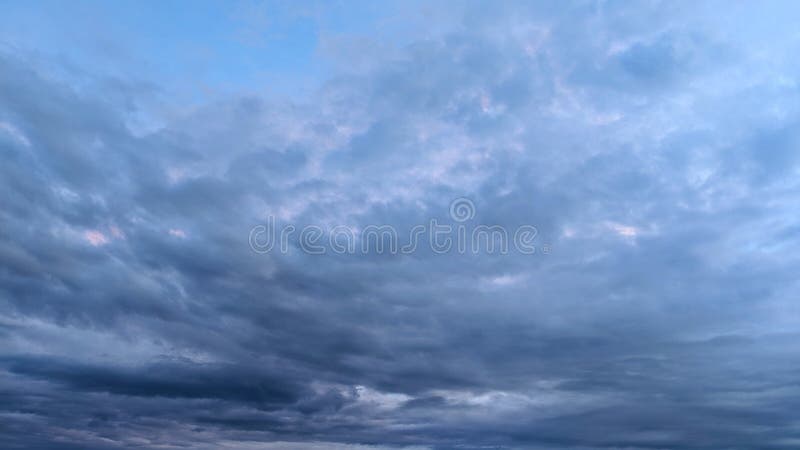 A Dramatic Sky Filled with Swirling, Gray Clouds. the Clouds Create a ...