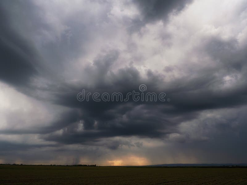 Dramatic Sky of Heavy Gray Clouds and Sunbeams Stock Image - Image of ...