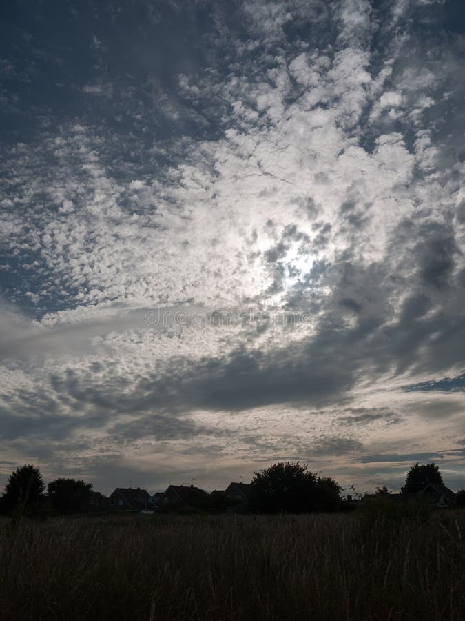 Dramatic Cloudy White Skies Above Village Scene in England during ...