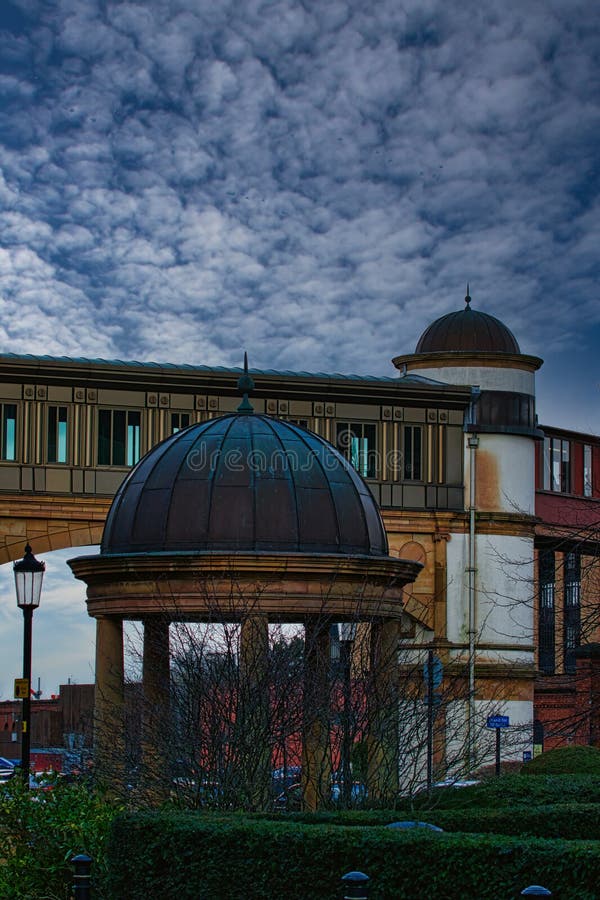 Dramatic Sky Over an Architectural Dome and Building with a Bridge in ...