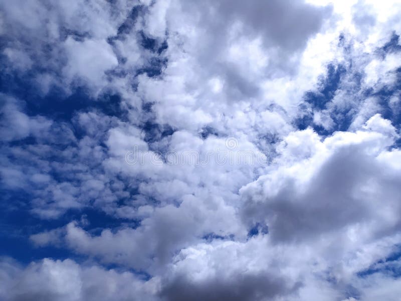 Dramatic Sky with Puffy White Clouds Against a Deep Blue Backdrop ...