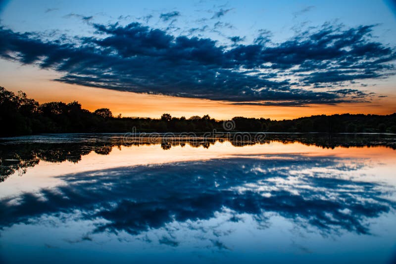 Dramatic Sky with Reflection in the Lake Stock Photo - Image of sunrise ...