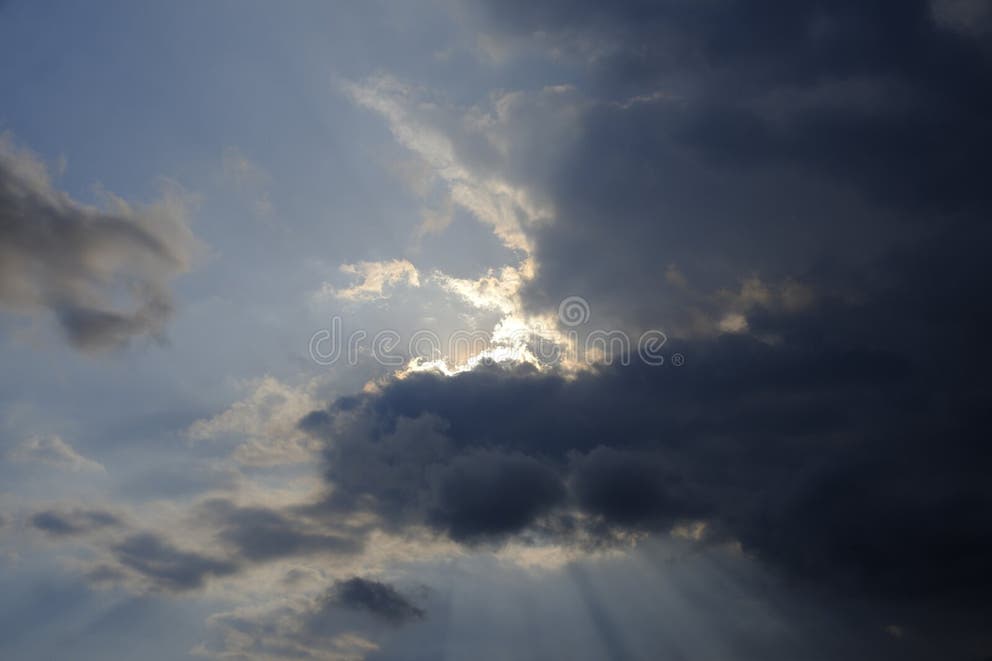Sunbeams Breaking through Dark Clouds Stock Photo - Image of ...