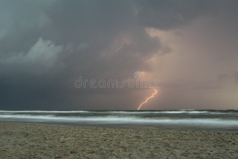 Lightning Bolt Strikes in the Water from a Thunderstorm Over Sea Stock ...