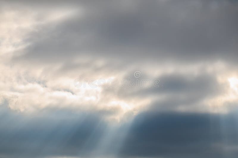 Dramatic Sky with Sun Rays Breaking through Dark Clouds Stock Image ...