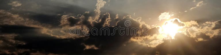 Dramatic Sky with Sun Rays through Dark Clouds or Golden Hour Sunbeams ...