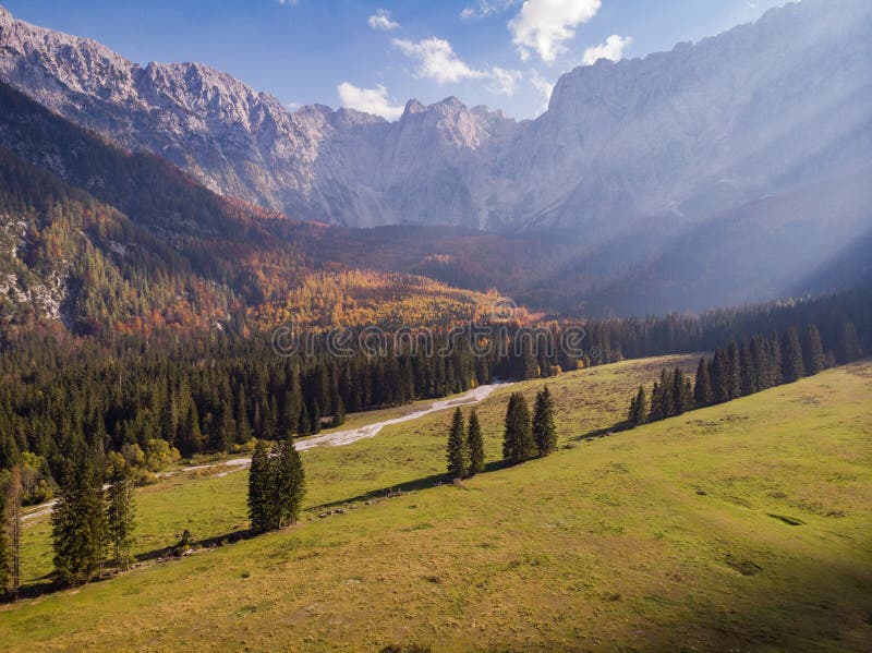 Dramatic Sky with Sun Rays Over Alpine Valley Stock Photo - Image of ...