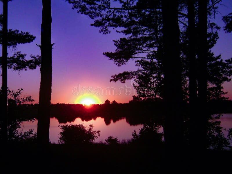 Dramatic Sky and Sunset in Forest Over Lake Water Stock Photo - Image ...