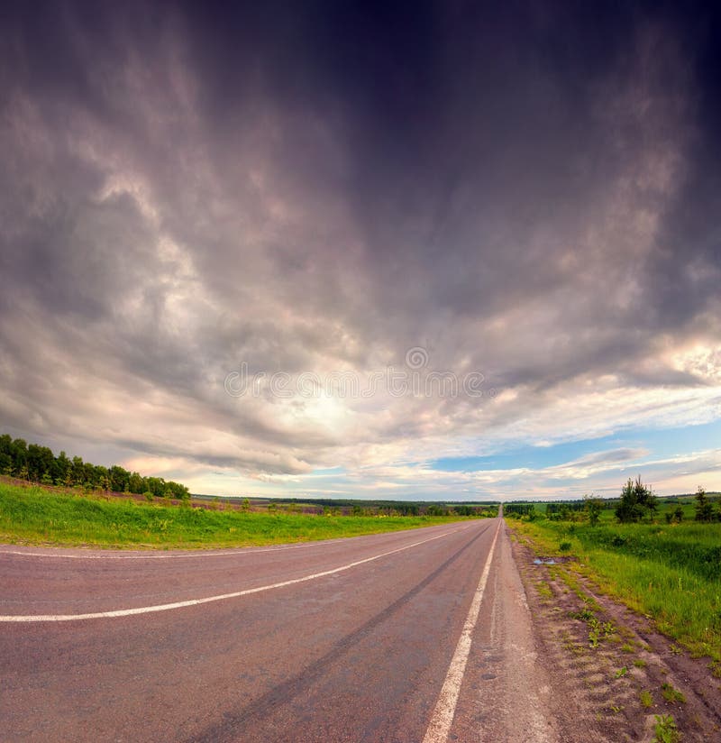 Dramatic Sky Under Country Asphalt Road. Stock Photo - Image of evening ...