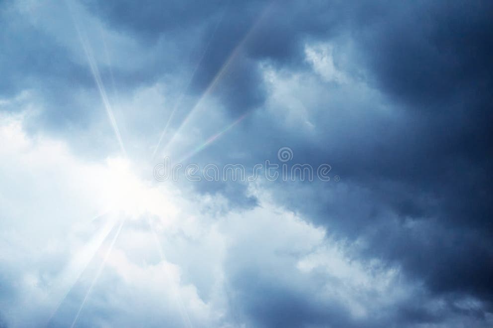 Dramatic Storm Clouds with a Bright Ray of Sunlight Breaking through. a ...