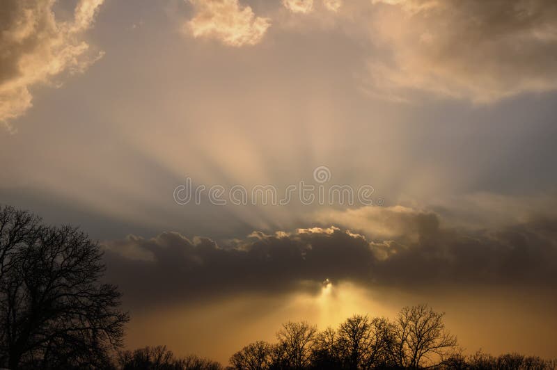 Dramatic Storm Clouds in the Evening, with Sun Rays Shining through the ...
