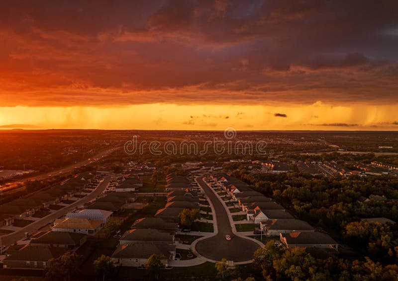 Dramatic Storm Clouds Lit by Setting Sun Over Texas Retirement ...