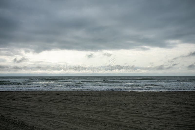 A Dramatic Stormy Sky Over a Dark Beach Stock Image - Image of ocean ...