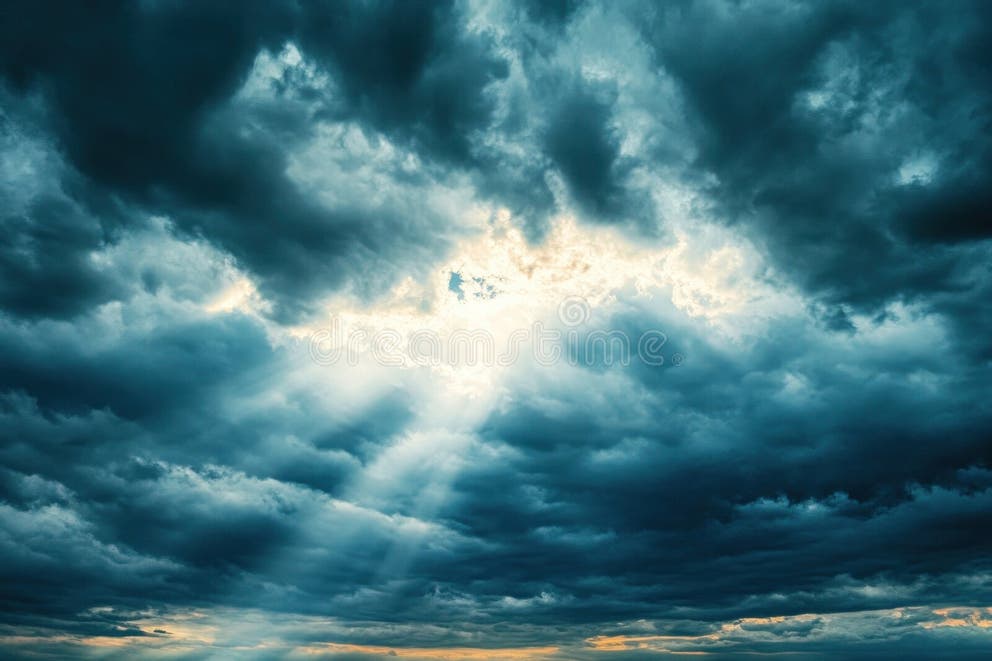 Dramatic Stormy Sky with Sun Rays Breaking through Dark Clouds Stock ...