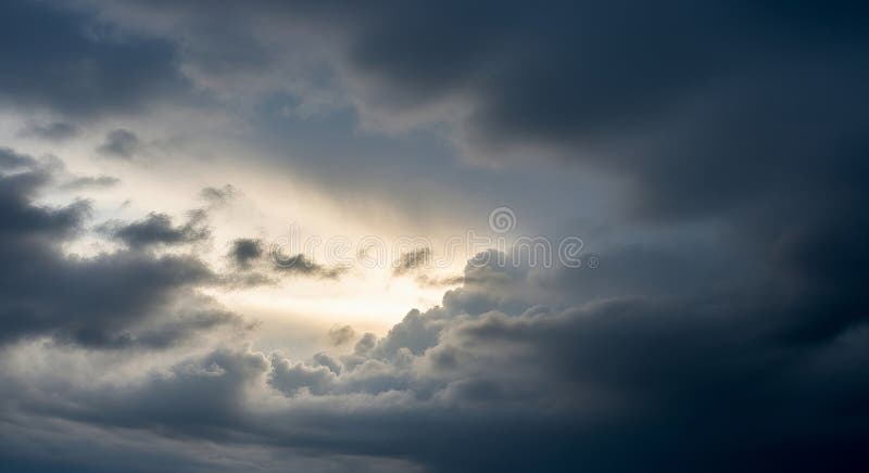 Dramatic Stormy Sky with Sunlight Breaking through Dark Clouds ...