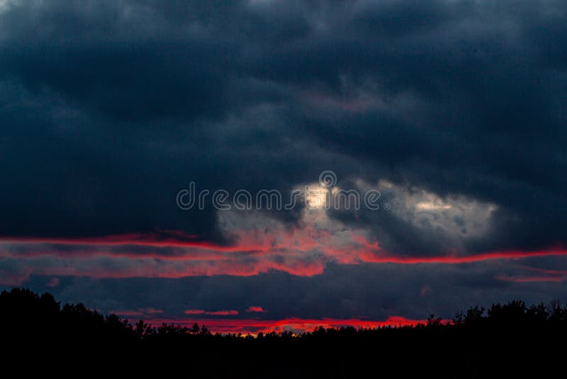 Dramatic Stormy Sunset Over Woodland Stock Image - Image of dramatic ...