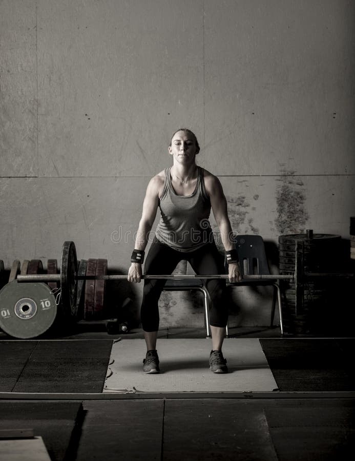 Dramatic Subdued Color Image of Strong Female Weight Lifter with ...