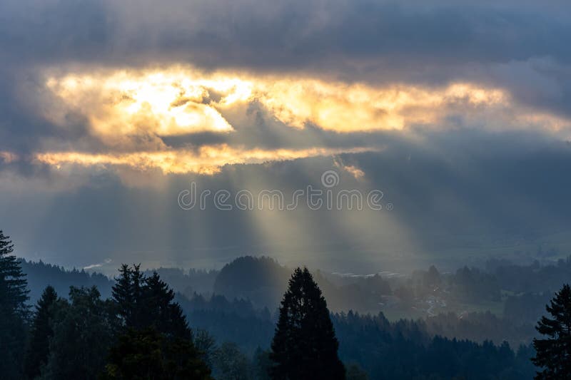 Dramatic Sun Ray Shining through Clouds on Hills and Forests in German ...
