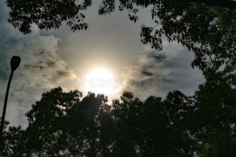 Dramatic Sun Rays through Dark Sky, with Filter Stock Photo - Image of ...
