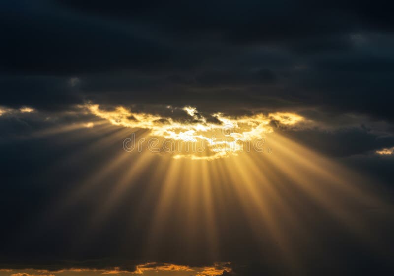 Dramatic Sun Rays Penetrating Dark Clouds in a Stunning Sky View Stock ...