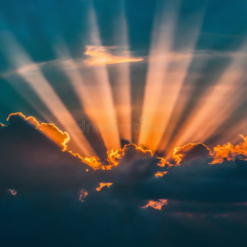 Dramatic Sunrise with Blue Sky and Orange Sun Rays Breaking through ...