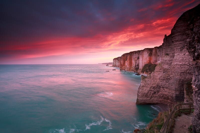 Dramatic Sunrise Over Ocean and Cliffs Stock Photo - Image of cloud ...
