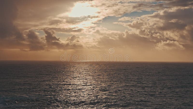 Dramatic Sunrise Over the Ocean. a Ray of the Sun Breaks through the ...